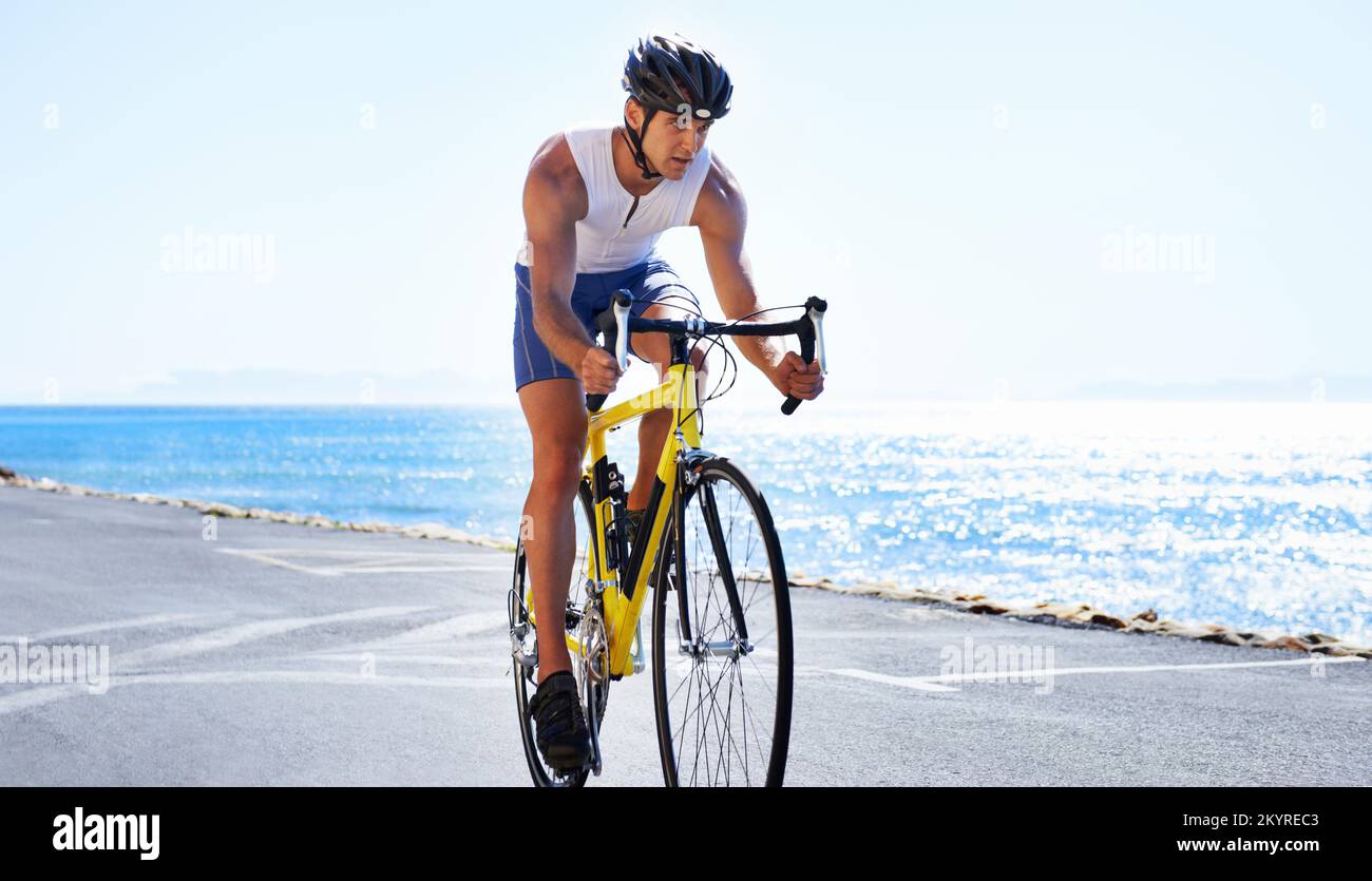 Enjoying the scenery while exercising. Cropped view of a cyclist ...