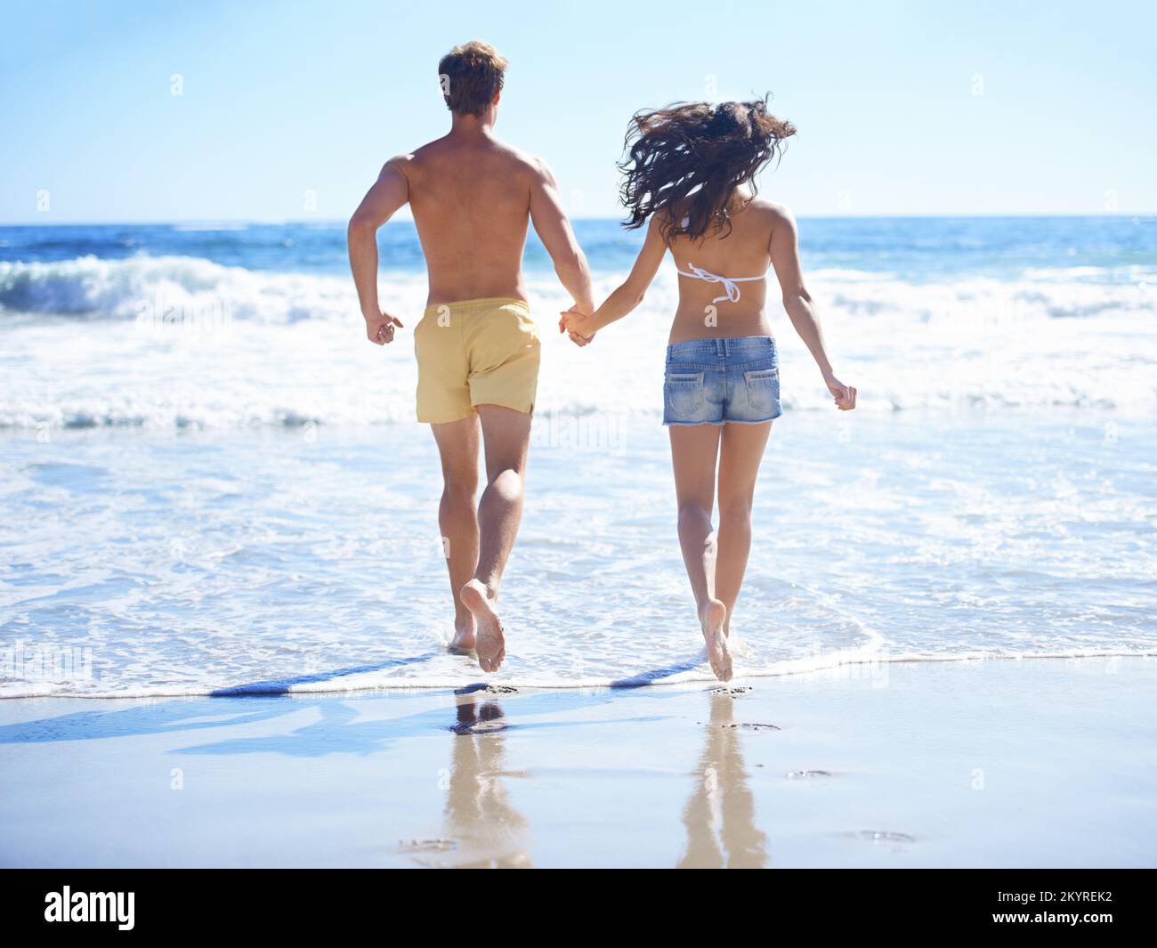 Woman Running On Beach