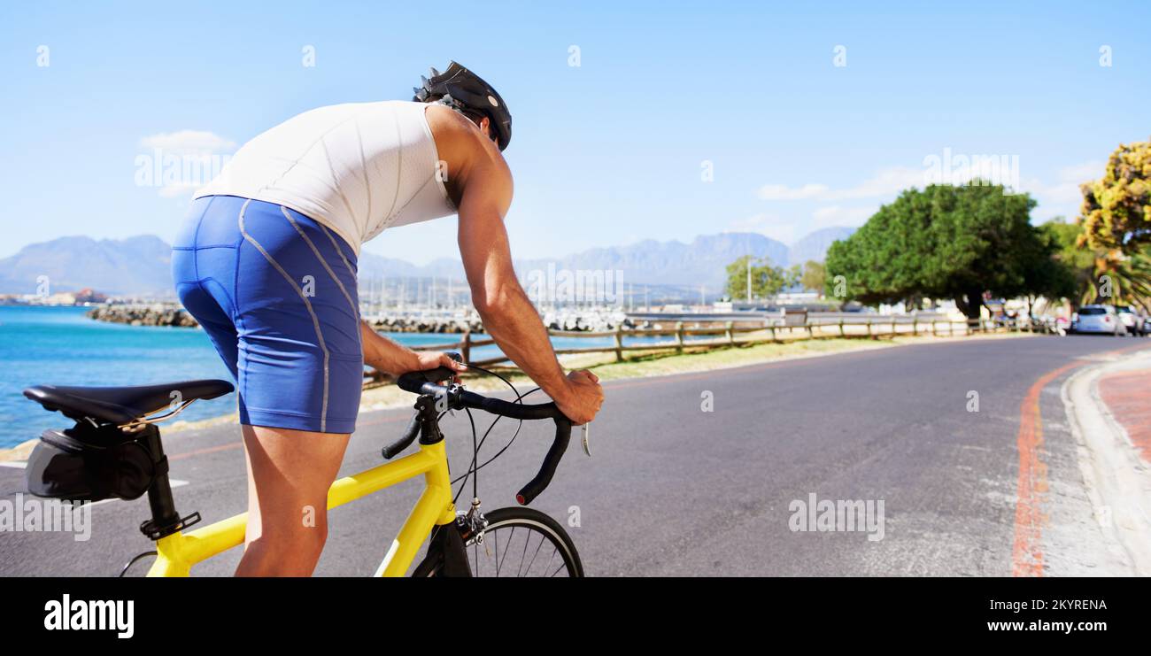 Enjoying the scenery while exercising. Cropped view of a cyclist ...