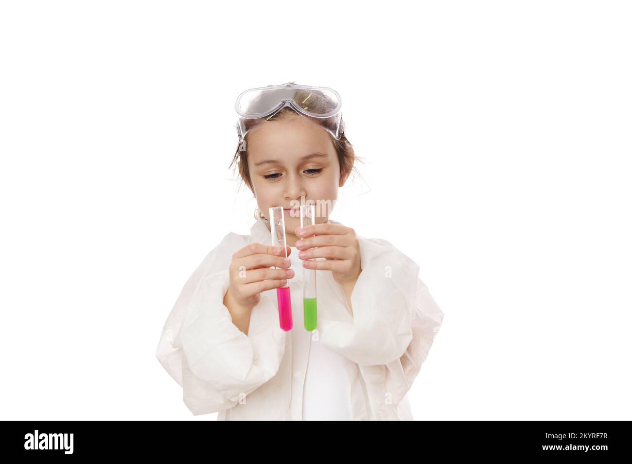 Smart preschooler girl, young chemist scientist, lifting up test tube ...