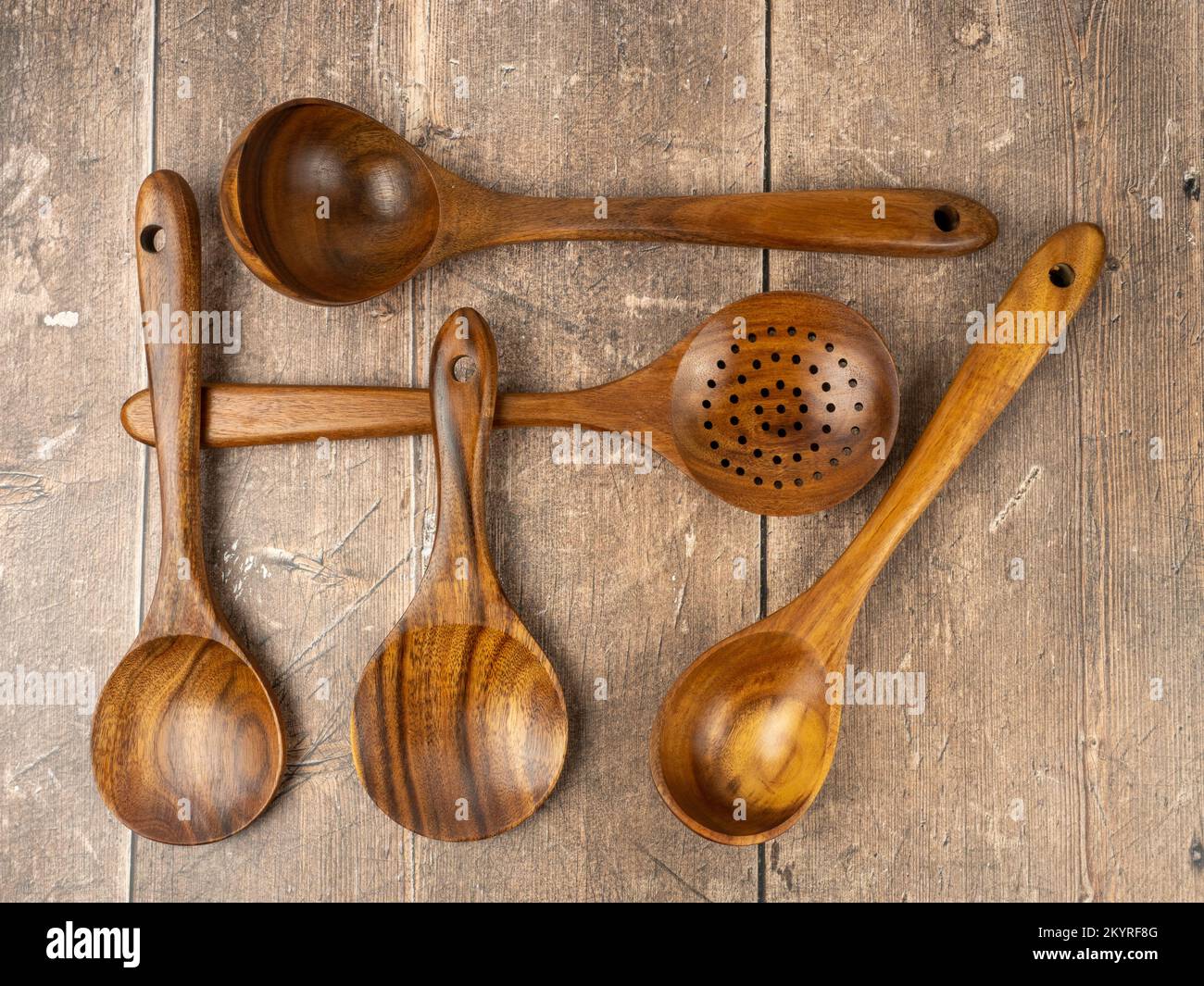 set of five kitchen engineered hardwood cooking utensils on a ...