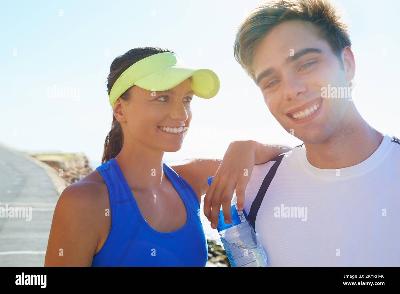 They met on the track. Portrait of a young athletic couple standing ...