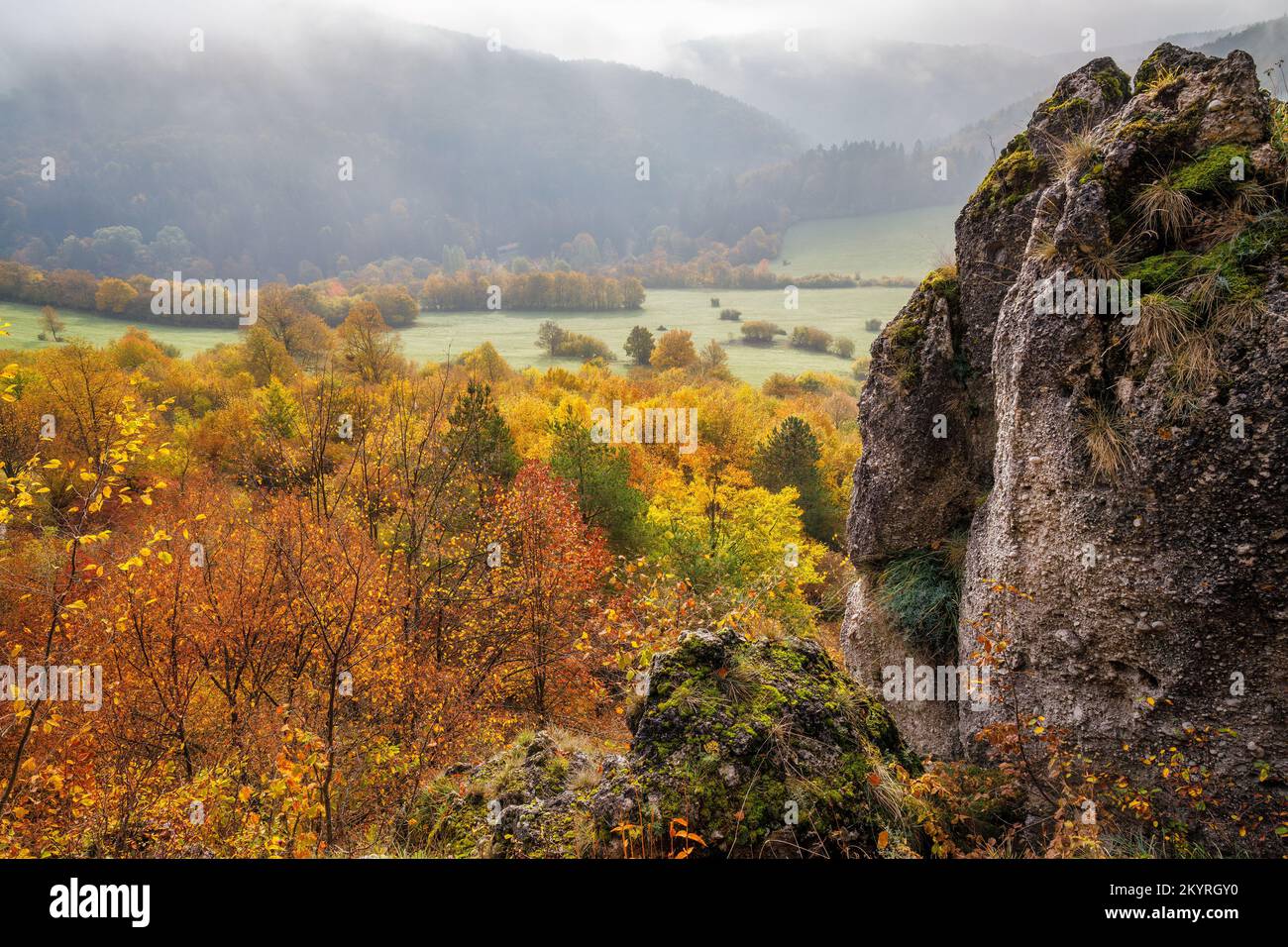 Mountain rocky landscape in autumn foggy morning. The Strazov Mountains ...