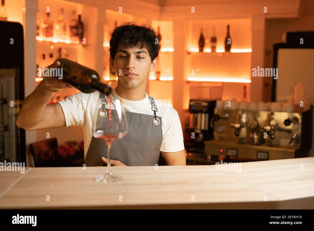 Waiter pours wine in wineglass hi-res stock photography and images - Alamy