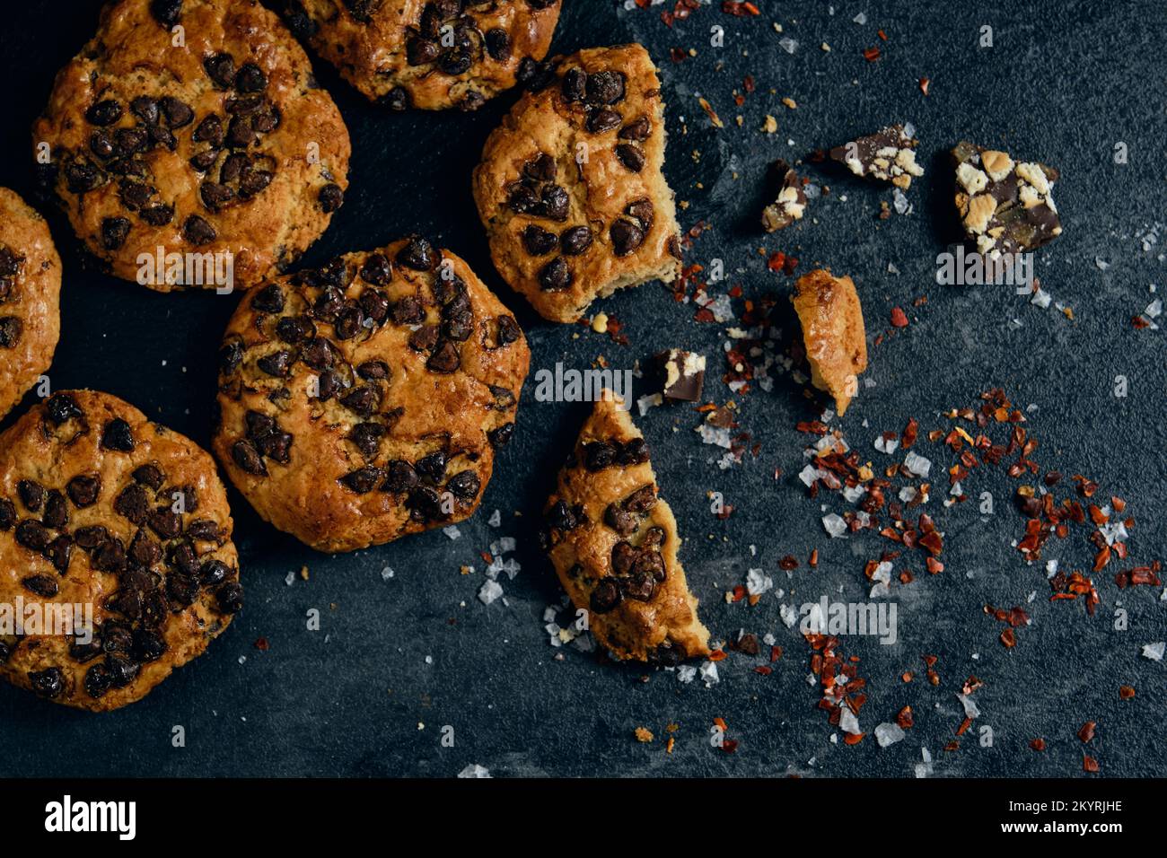 chocolate chip cookies on a dark background Stock Photo - Alamy