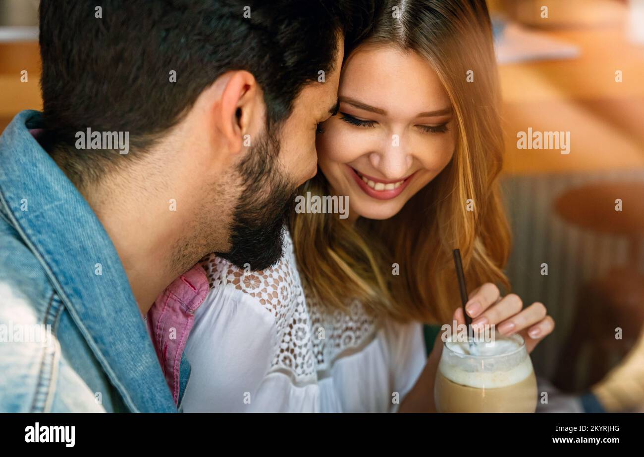 Romantic couple in cafe is drinking coffee and enjoying being together ...