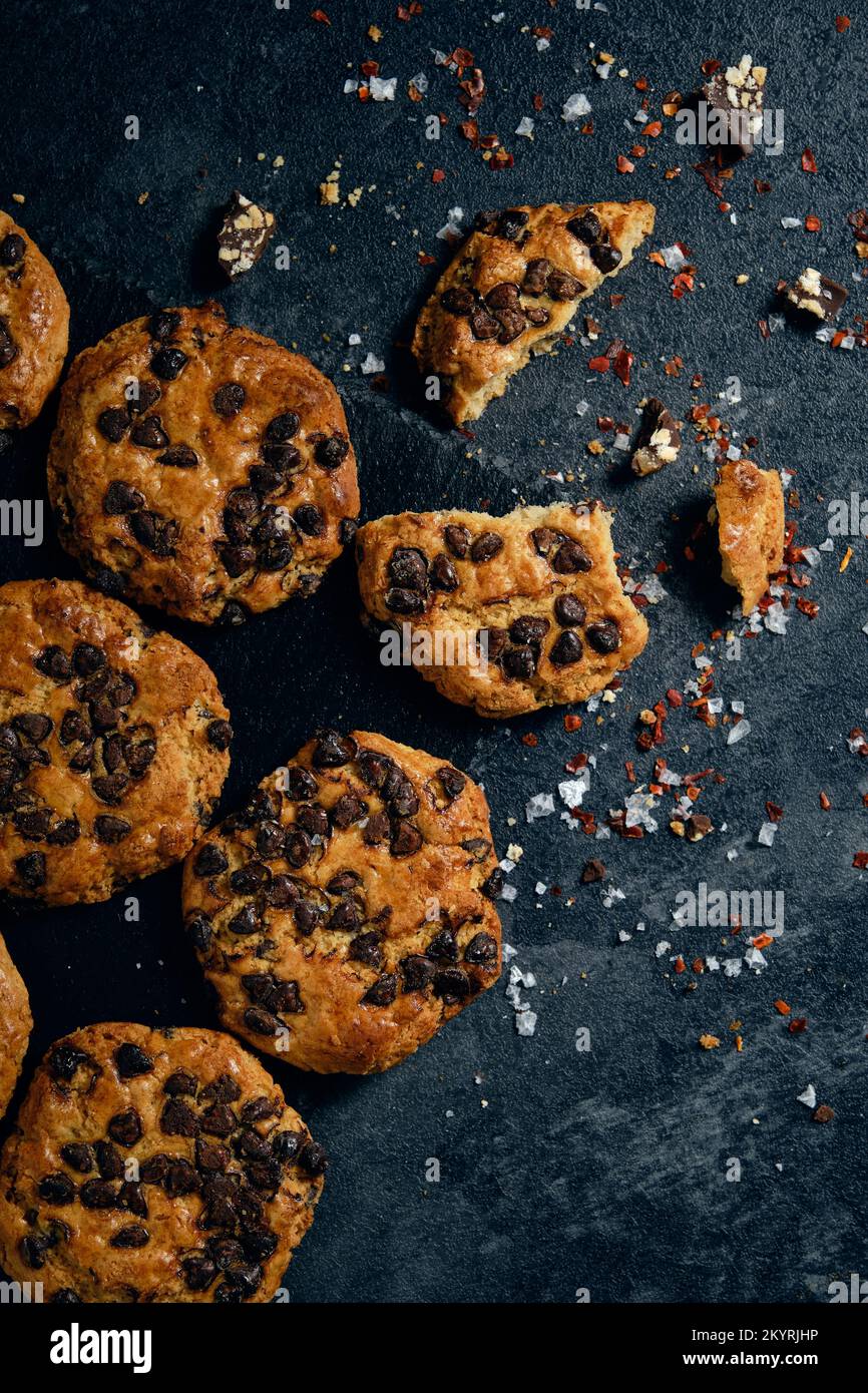 chocolate chip cookies on a dark background Stock Photo - Alamy
