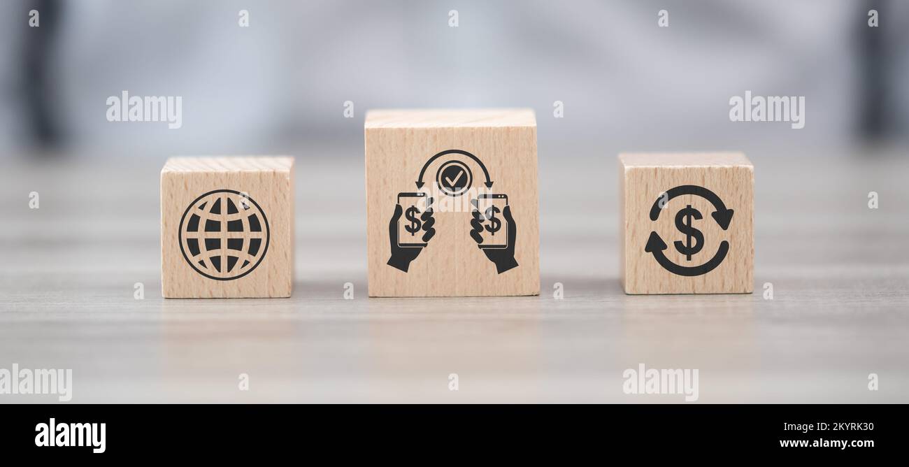 Wooden blocks with symbol of money transfer concept Stock Photo - Alamy