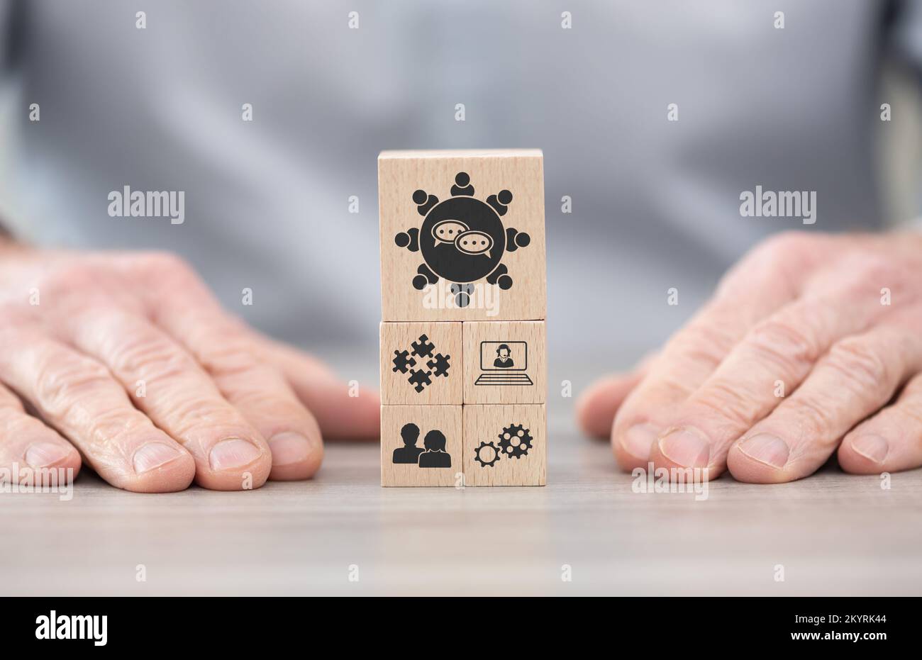 Wooden blocks with symbol of meeting concept Stock Photo - Alamy