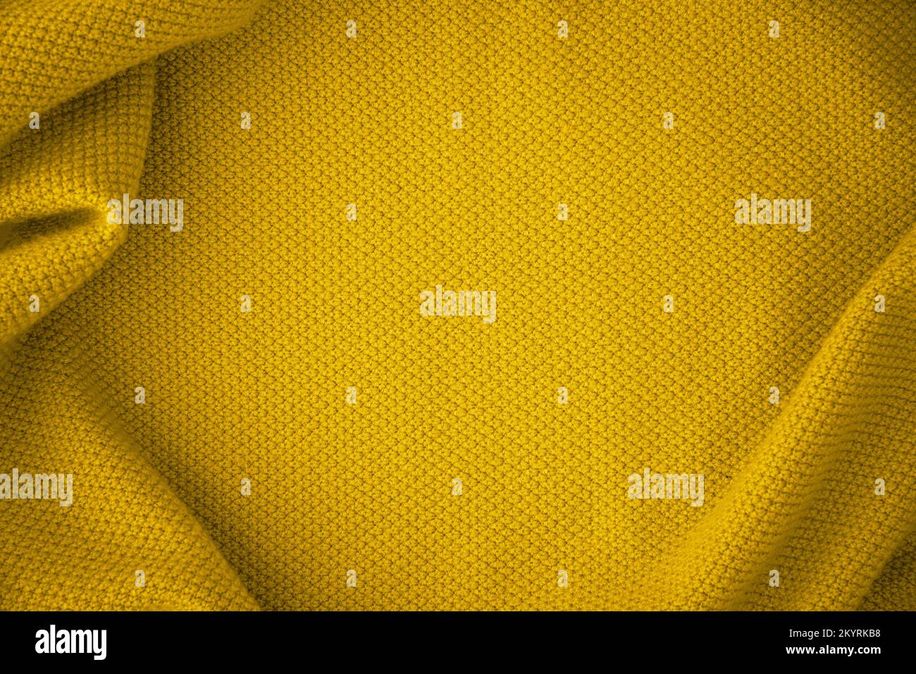 Texture of knitted fabric in trendy yellow sun color Stock Photo - Alamy
