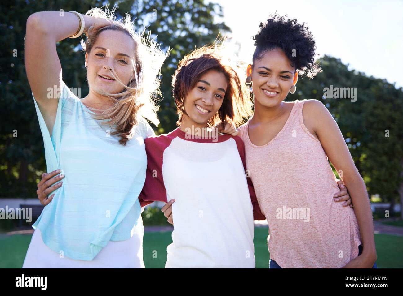 Childhood friends all grown up. Portrait of three young friends ...