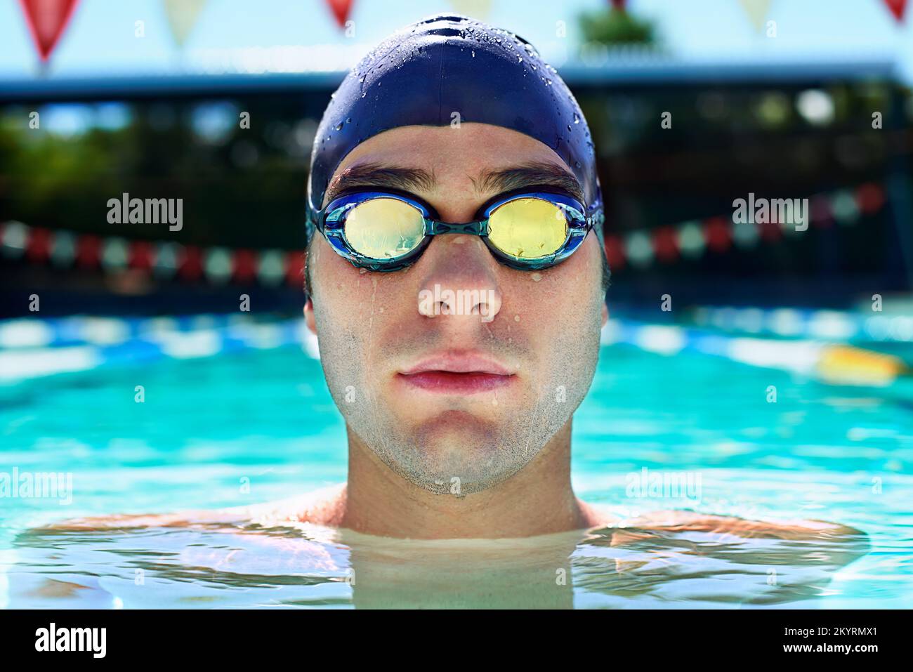 Born to swim. Cropped portrait of a male swimmer looking serious while ...