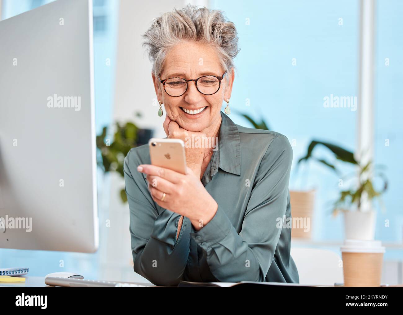 Senior business woman, ceo with smartphone for company communication ...