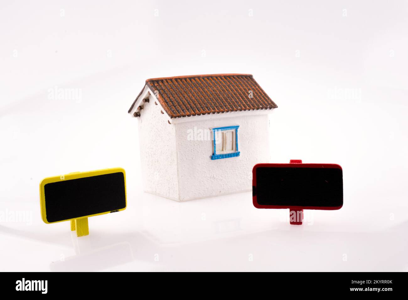 House and sign board on a white background Stock Photo - Alamy