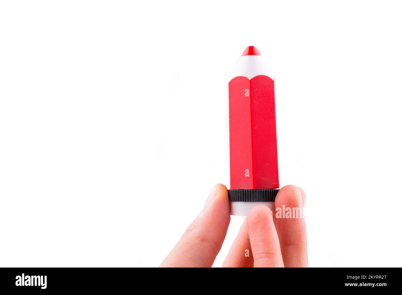 Hand holding a red model pencil in hand on white background Stock Photo ...
