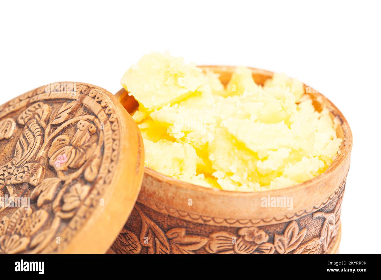 Ghee in wooden bowl isolated on white background Stock Photo - Alamy