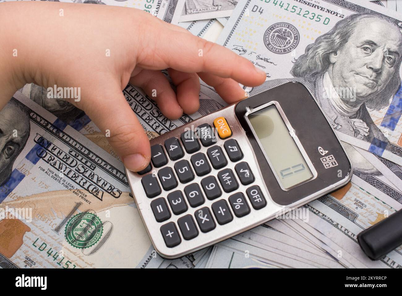 Money child calculator hi-res stock photography and images - Alamy