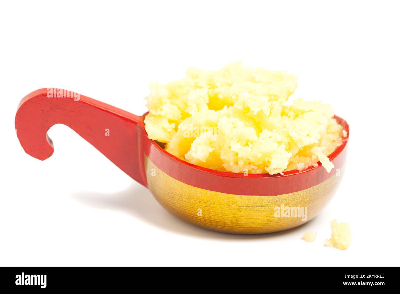 Ghee in wooden spoon isolated on white background Stock Photo - Alamy