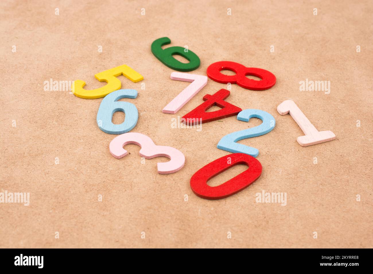 Colorful numbers on a wooden background Stock Photo - Alamy