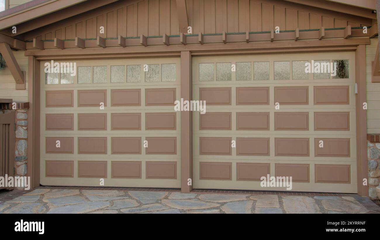 Panorama Puffy clouds at sunset Attached garage exterior with vinyl lap ...