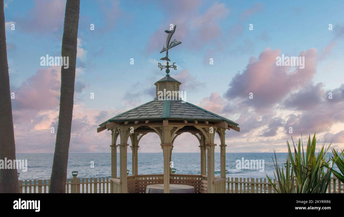 Panorama Puffy clouds at sunset Gazebo with built in seat and table in ...
