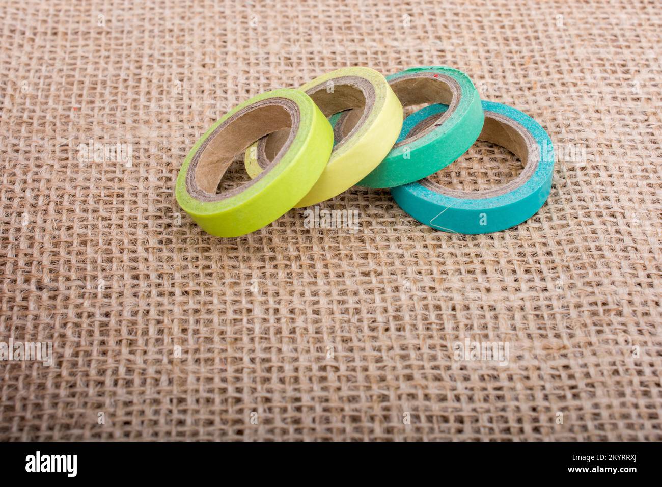Colorful insulating adhesive tape on linen canvas background Stock ...