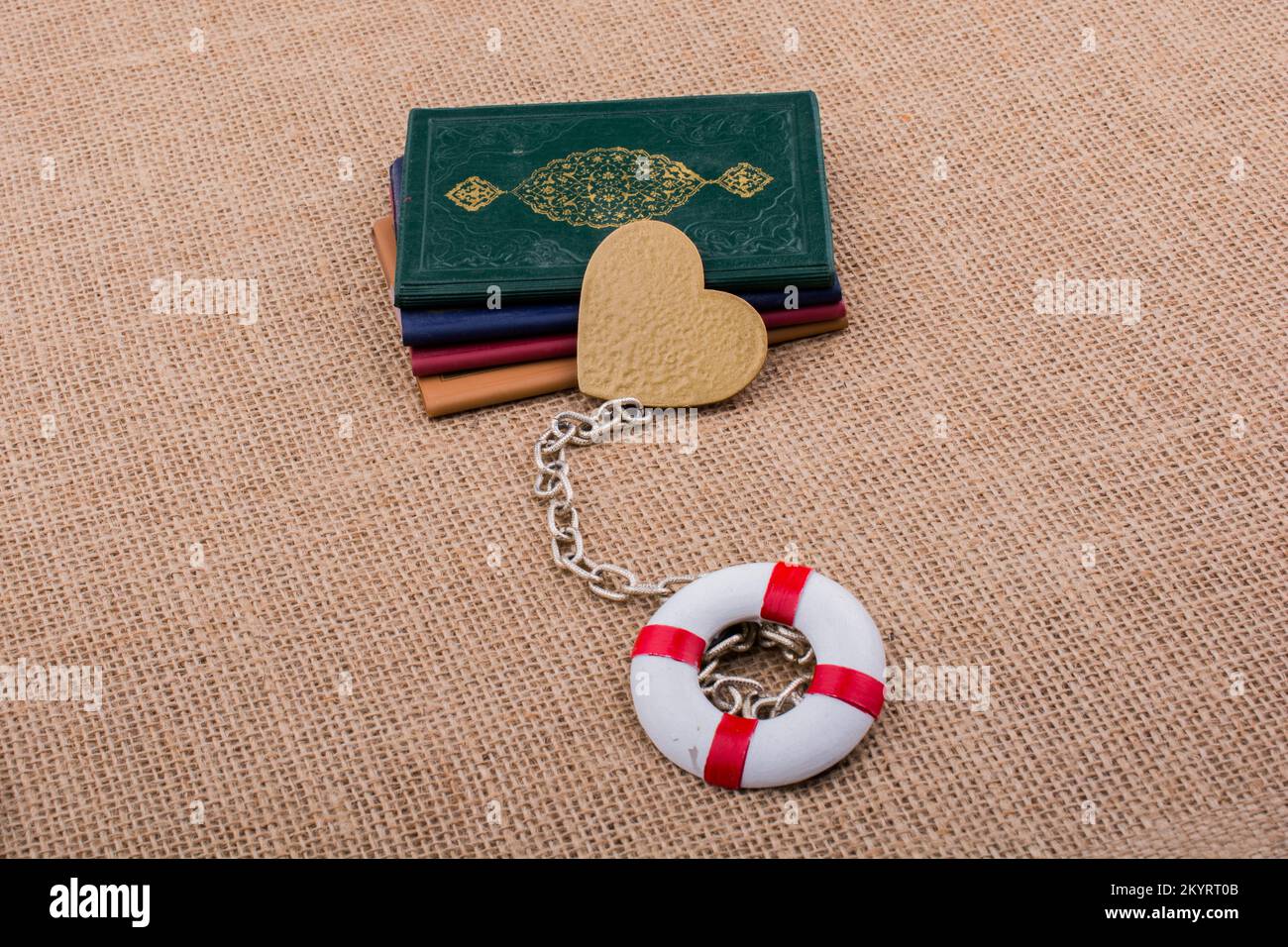 Little books attached to a life saver with a chain Stock Photo - Alamy