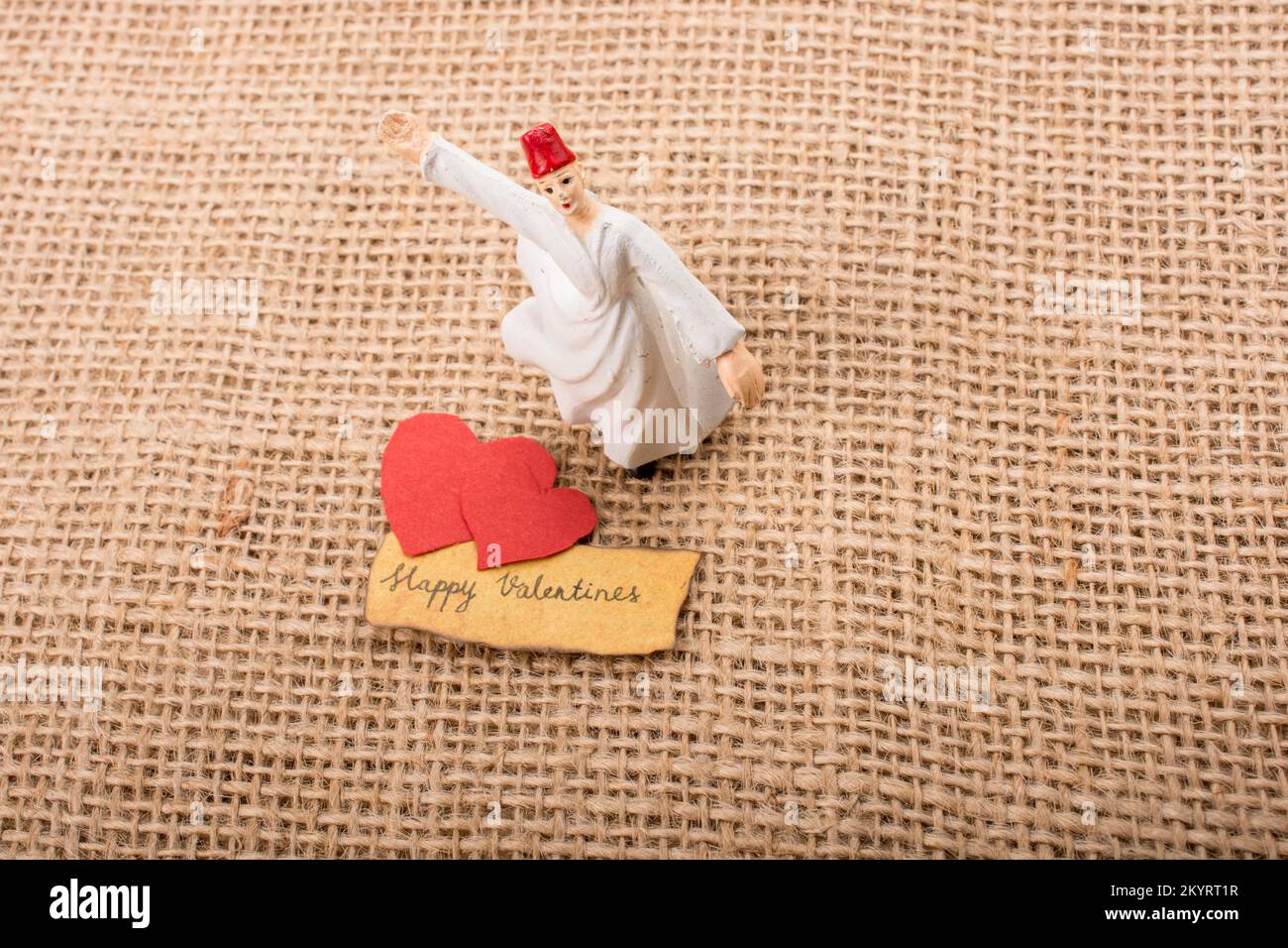 Love icon and Valentine's day wording on torn paper Stock Photo - Alamy