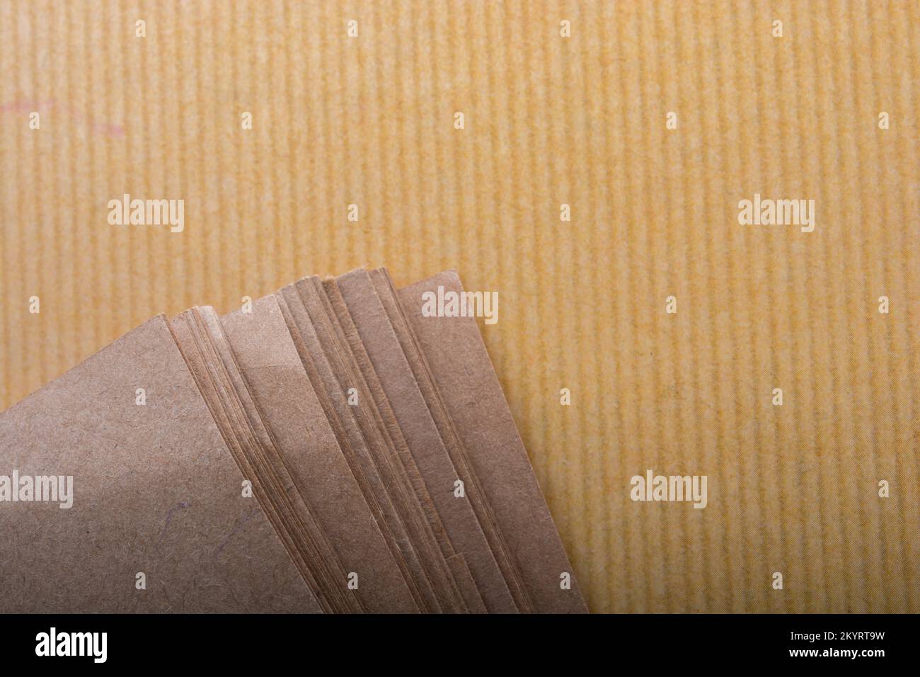Yellow color torn paper on a linen canvas Stock Photo - Alamy