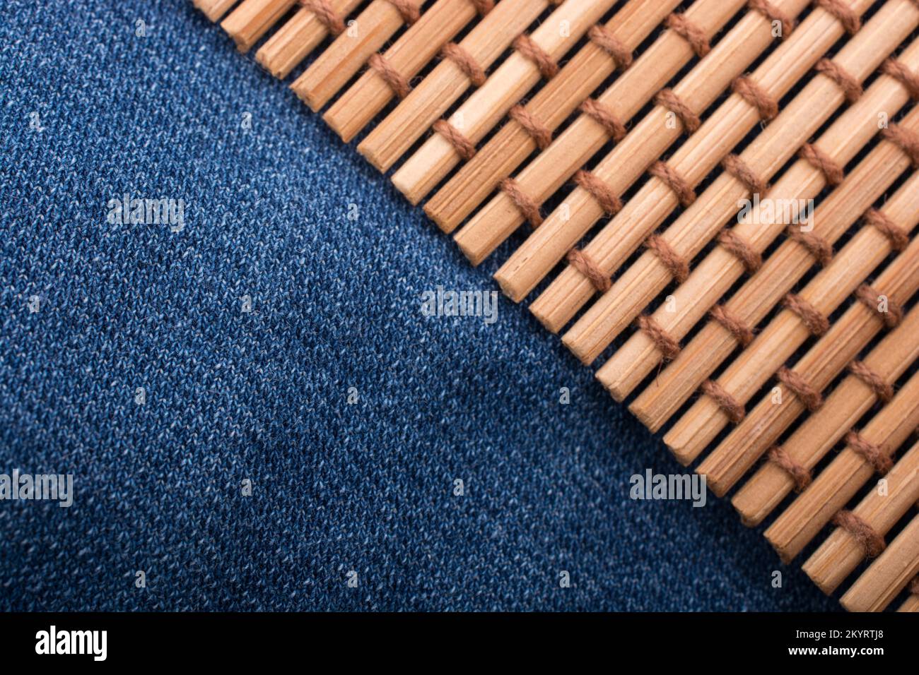 Straw mat placed on denim canvas as a background Stock Photo - Alamy