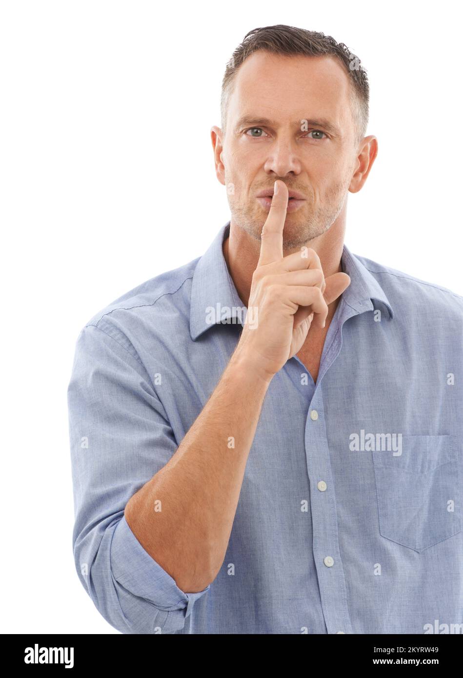 Dont make a sound...Studio portrait of a mature man shushing the camera ...