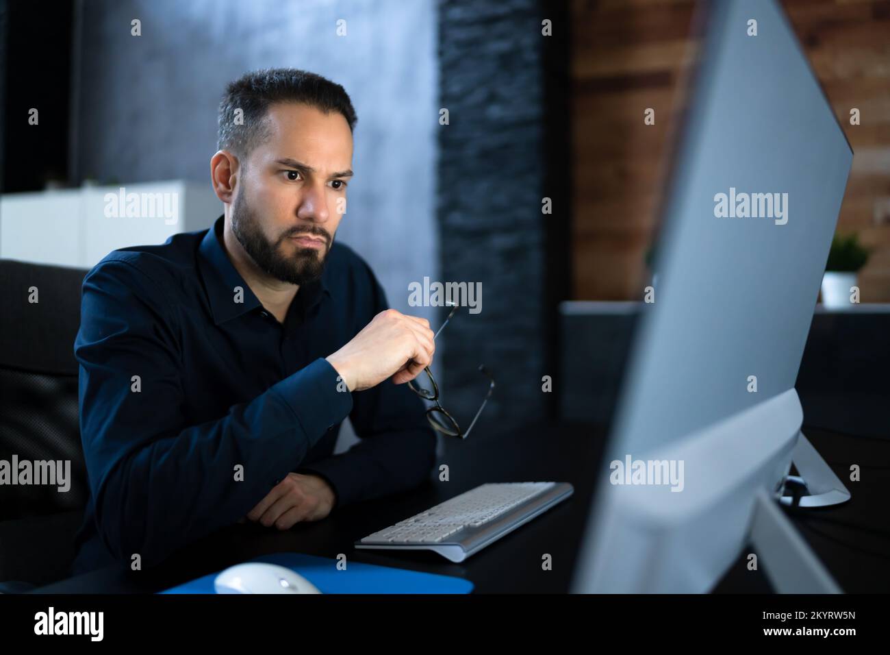 Late Night Workaholic Busy Business Man At Computer Stock Photo - Alamy