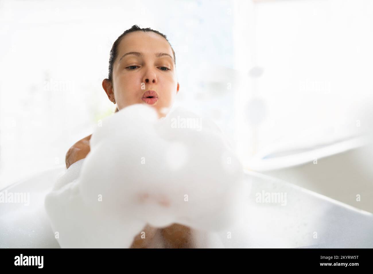 Bathtub blowing bubble hi-res stock photography and images - Alamy
