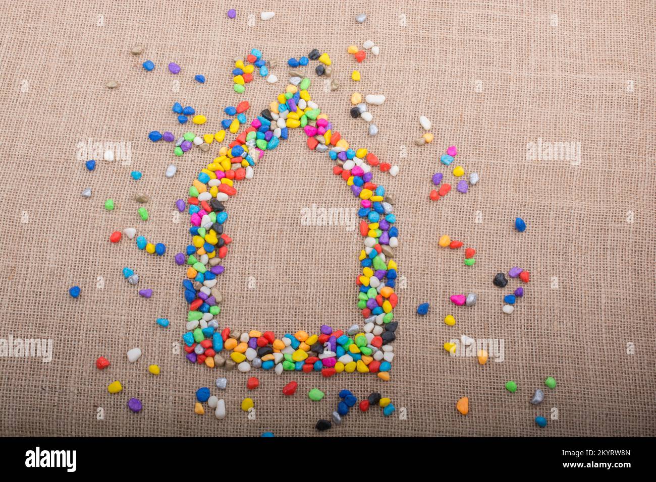 House form shaped by some colorful pebbles Stock Photo - Alamy