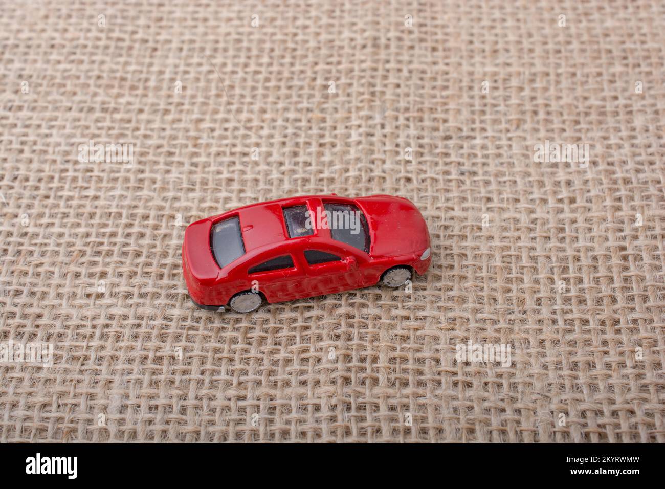 Colorful little toy car on canvas background Stock Photo - Alamy
