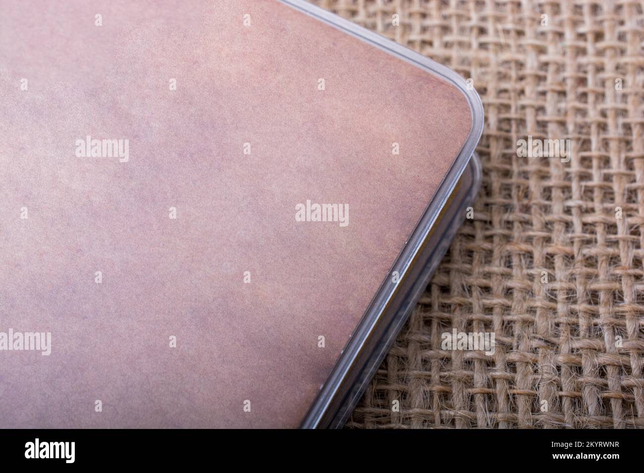 Brown color notebook placed on a canvas background Stock Photo - Alamy