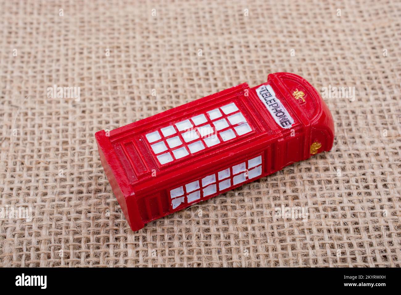 Red color phone booth on a canvas background Stock Photo - Alamy