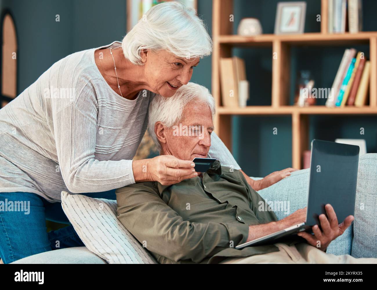 Senior couple, credit card and laptop on home sofa for ecommerce ...
