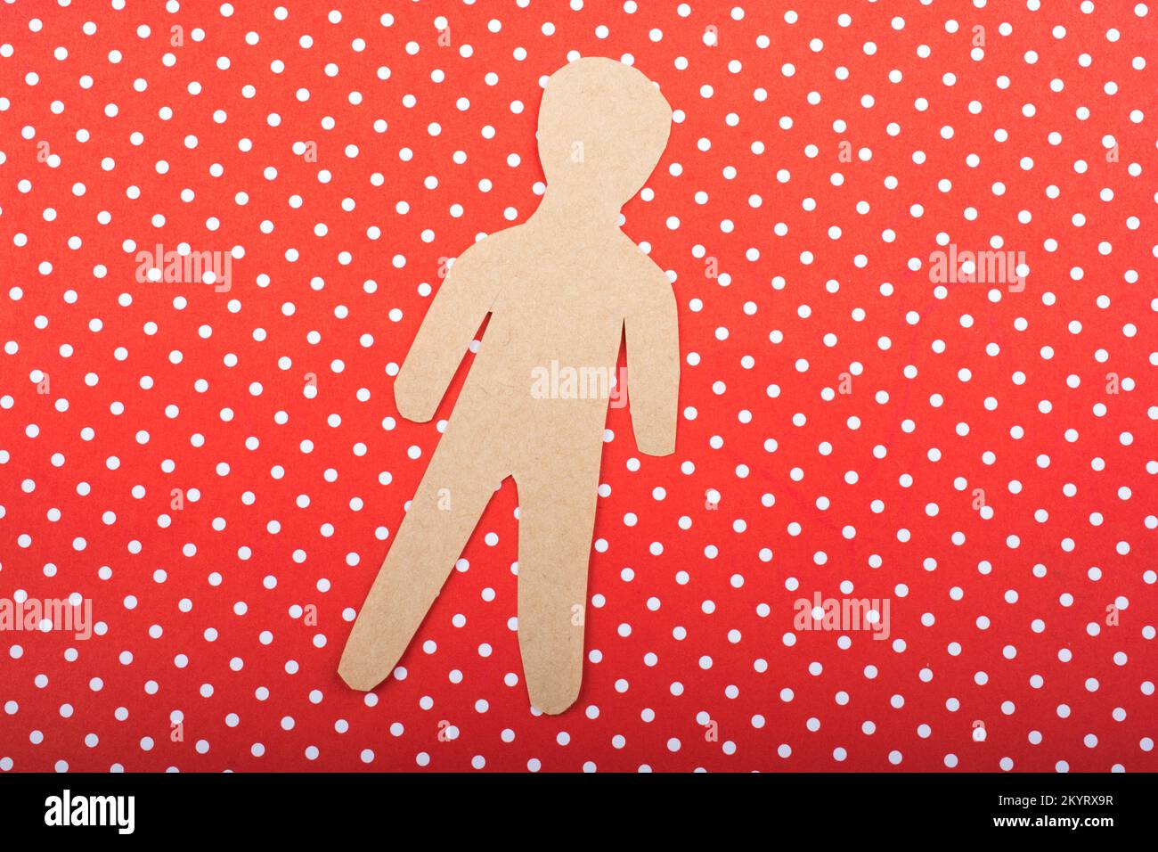 Little man figurine cut out of brown paper Stock Photo - Alamy