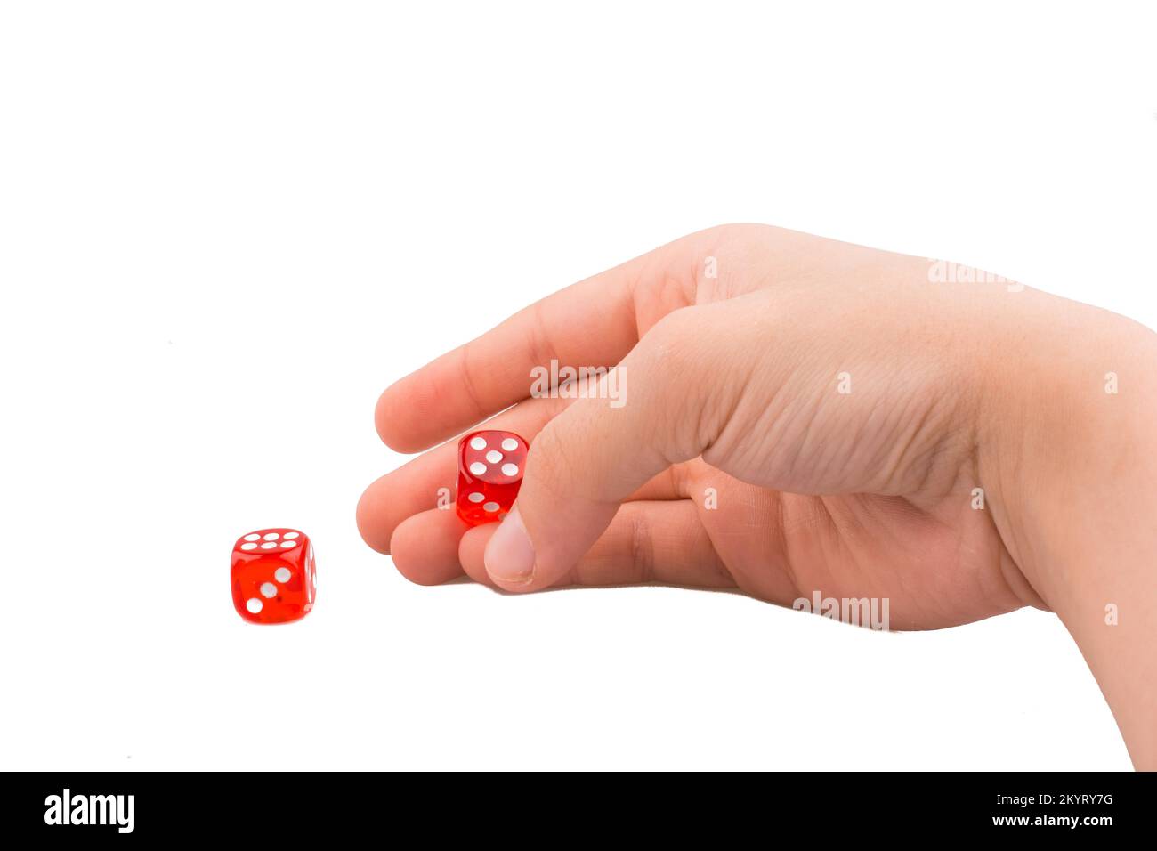 Hand holding red dice on a white background Stock Photo - Alamy