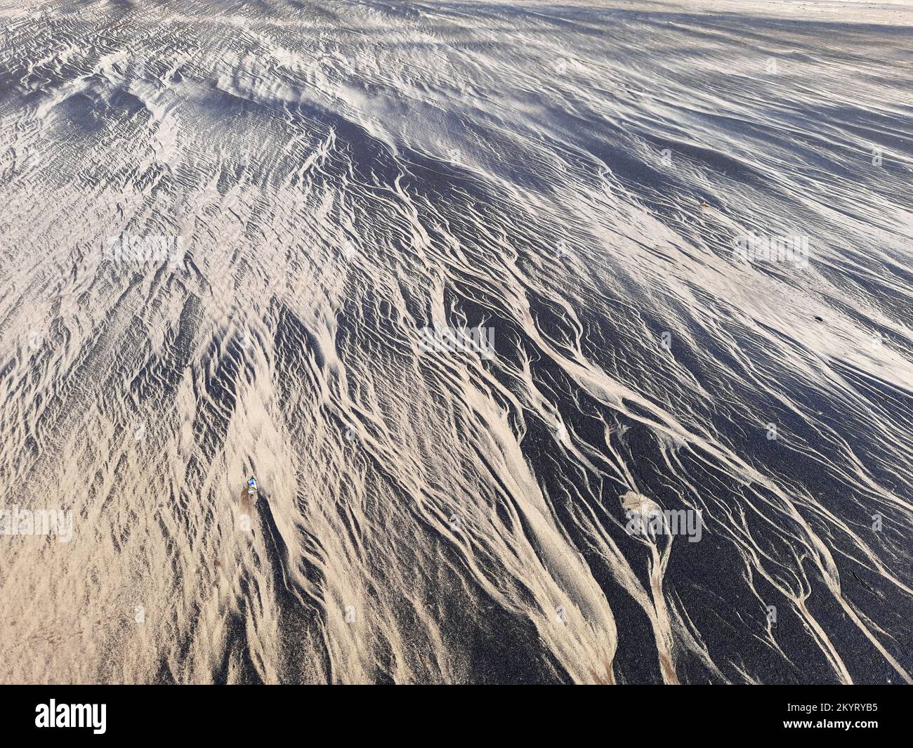 Natural design made by sea waves on the sandy beach of Varsoli near ...