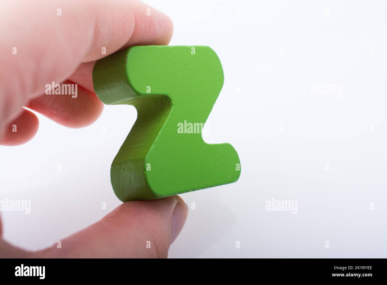 Hand holding letter cube Z of made of wood Stock Photo - Alamy