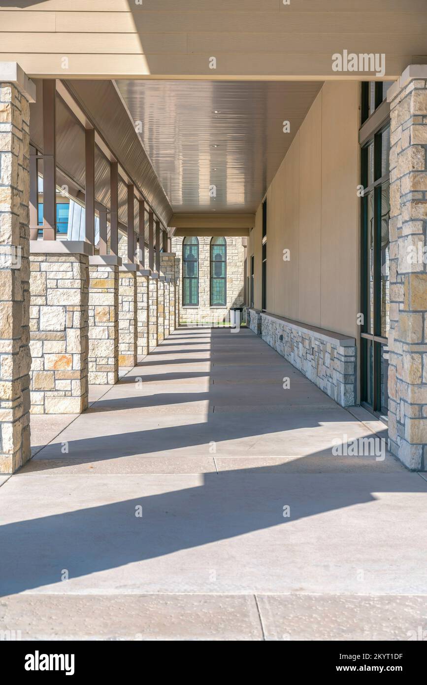 Walkway lined with posts for pedestrians outside a building in Austin ...