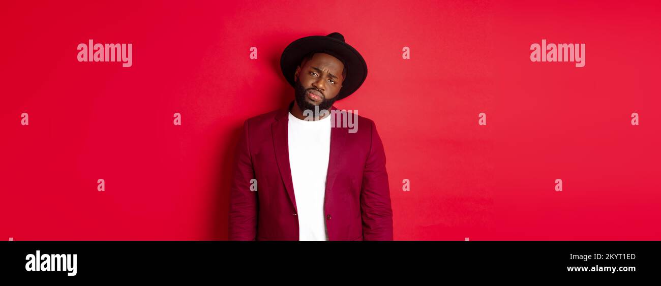 Sad and unamused Black man looking with pity at camera, frowning ...