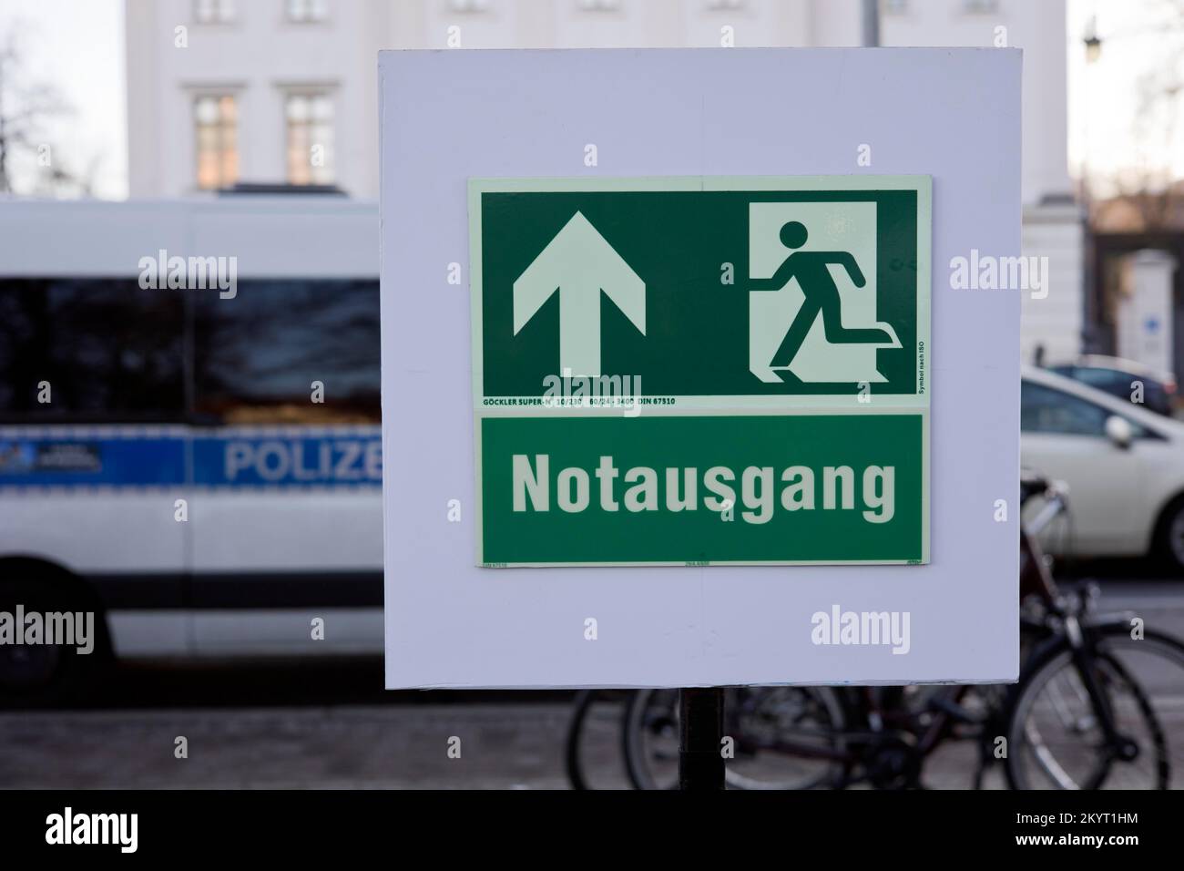 In the foreground a sign from the emergency exit, in the background a ...