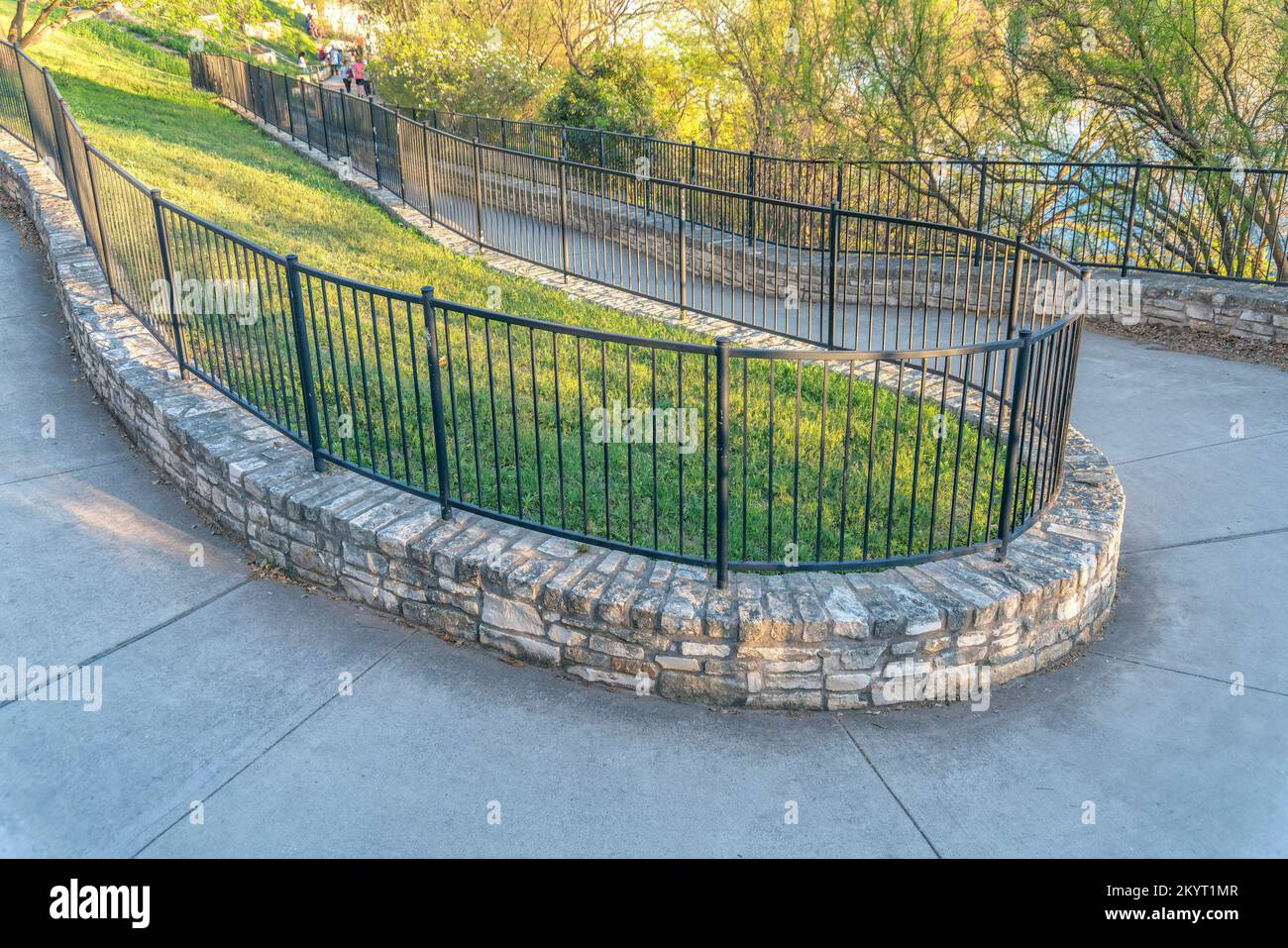 Paved walkway trail at a scenic park by the Colorado River in Austin ...