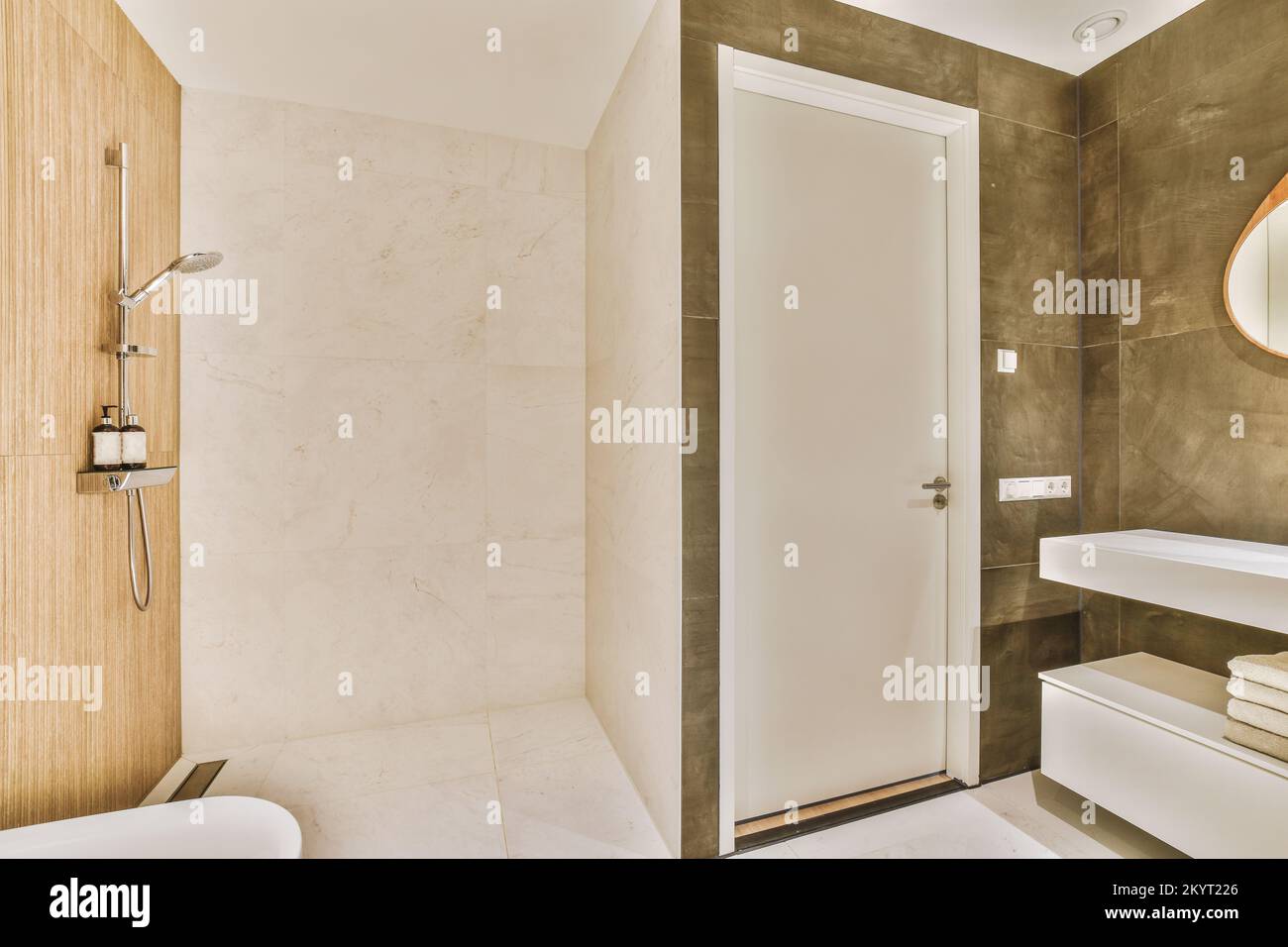 White ceramic sink and mirror with illumination in bathroom designed in ...