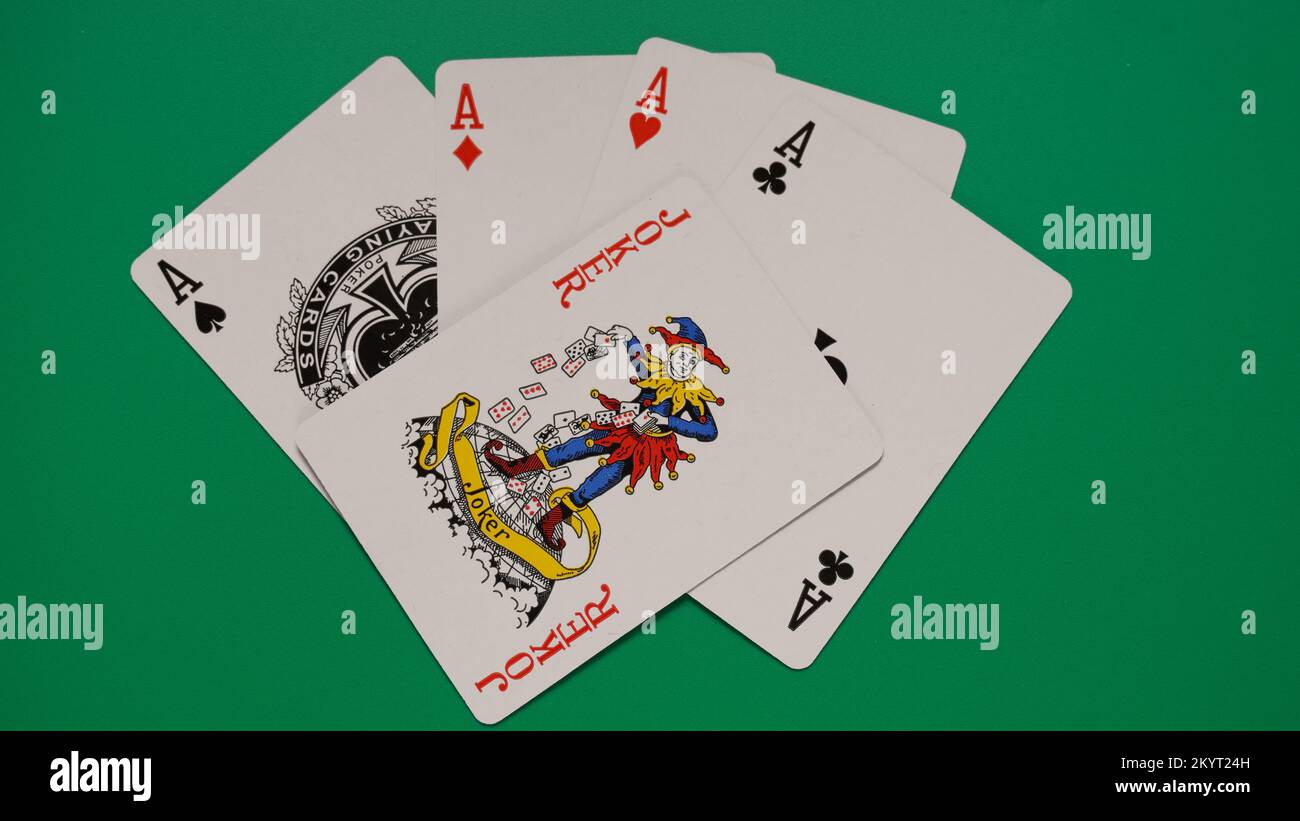 The combination of playing cards poker casino. Four aces and joker ...