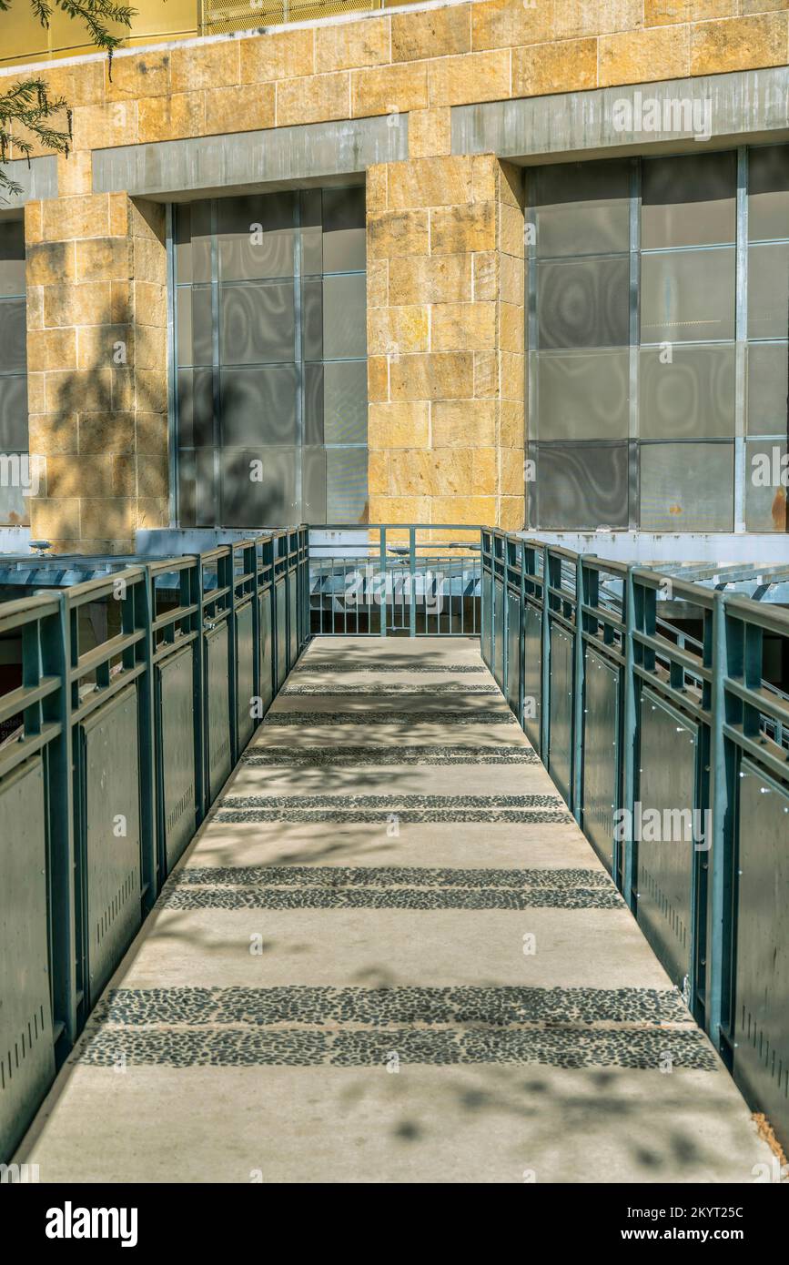Pedestrian walkway path flanked by safety metal railings in San Antonio ...