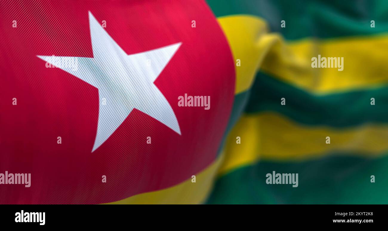 Close-up view of the Togo national flag waving in the wind. The Togolese Republic is a country ...